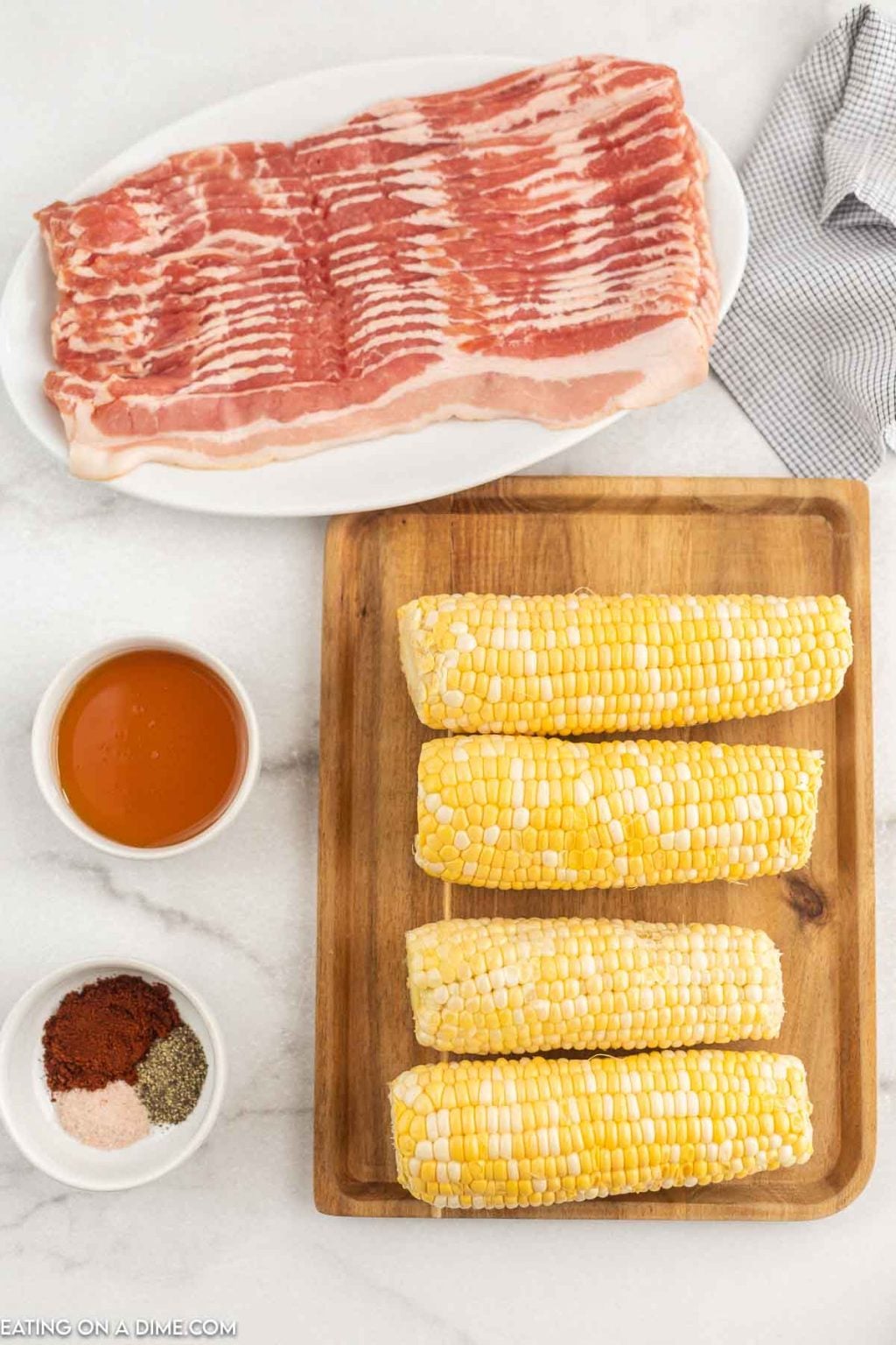 Corn on the Cob Wrapped in Bacon - Eating on a Dime